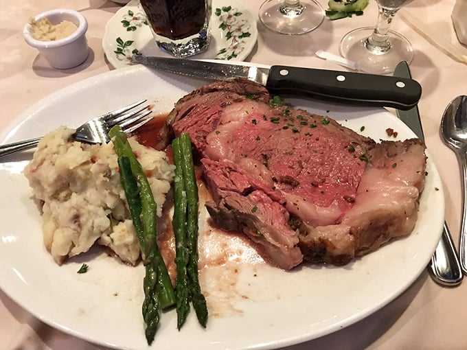 Prime rib perfection – a masterclass in meat preparation where each tender, pink-centered slice tells a story of patience and culinary expertise.