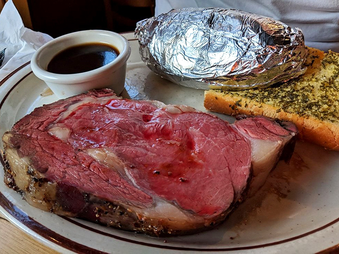 Prime rib perfection—a rosy center surrounded by a seasoned crust that makes you wonder why you'd ever order anything else.