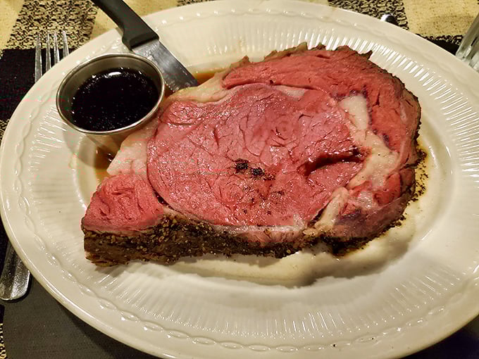 Behold the star of the show—prime rib so perfectly pink it should have its own Instagram account. Served with au jus for necessary meat-dipping rituals.
