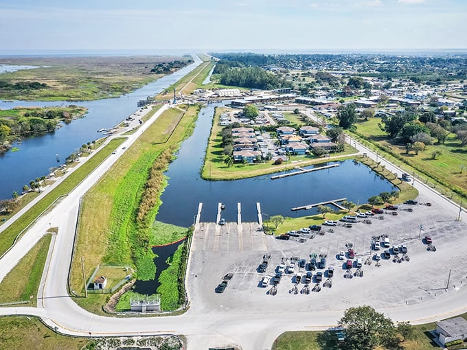 Where boats meet road at Clewiston's public ramp – the gateway to Lake Okeechobee adventures where fishing stories grow bigger than the catch. 