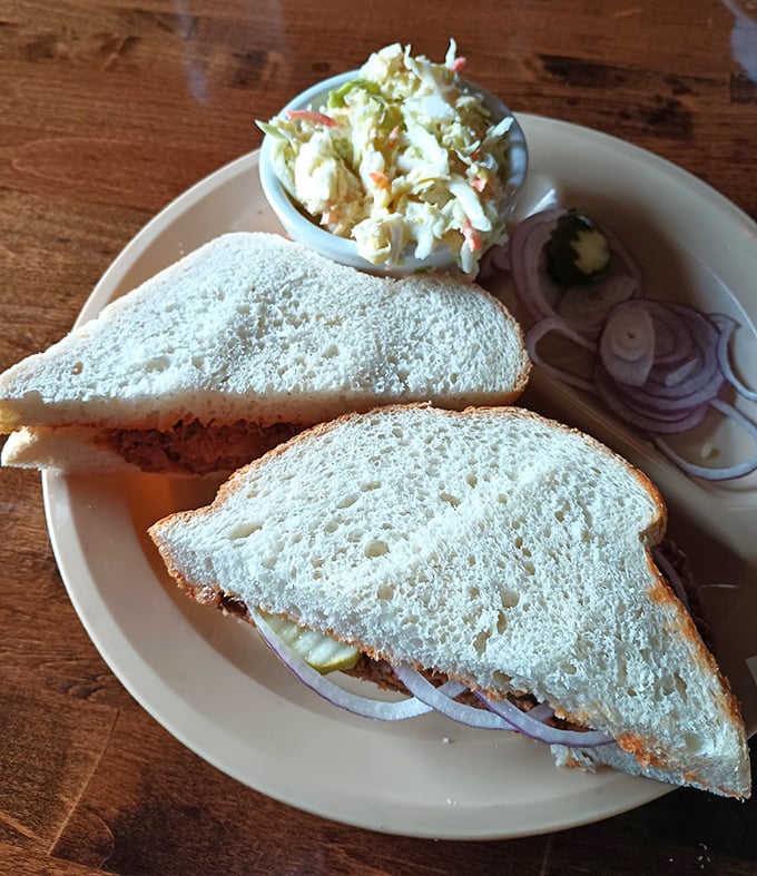 This pulled pork sandwich doesn't just satisfy hunger—it resolves it completely, with creamy coleslaw providing the perfect cool counterpoint.