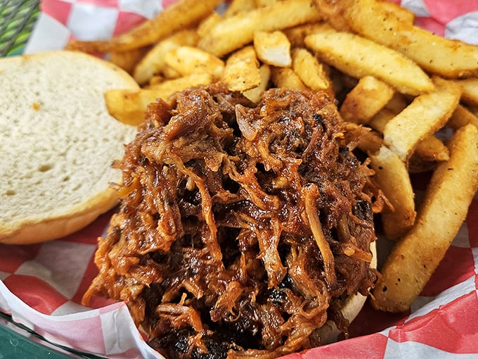 This isn't just pulled pork – it's a masterclass in barbecue, where each tender strand tells a story of patience and proper smoking technique.