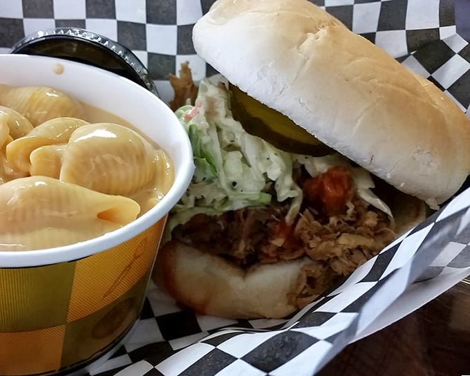 This isn't just a pulled pork sandwich; it's a masterclass in texture – tender meat, creamy slaw, and mac and cheese that would make your grandma jealous.