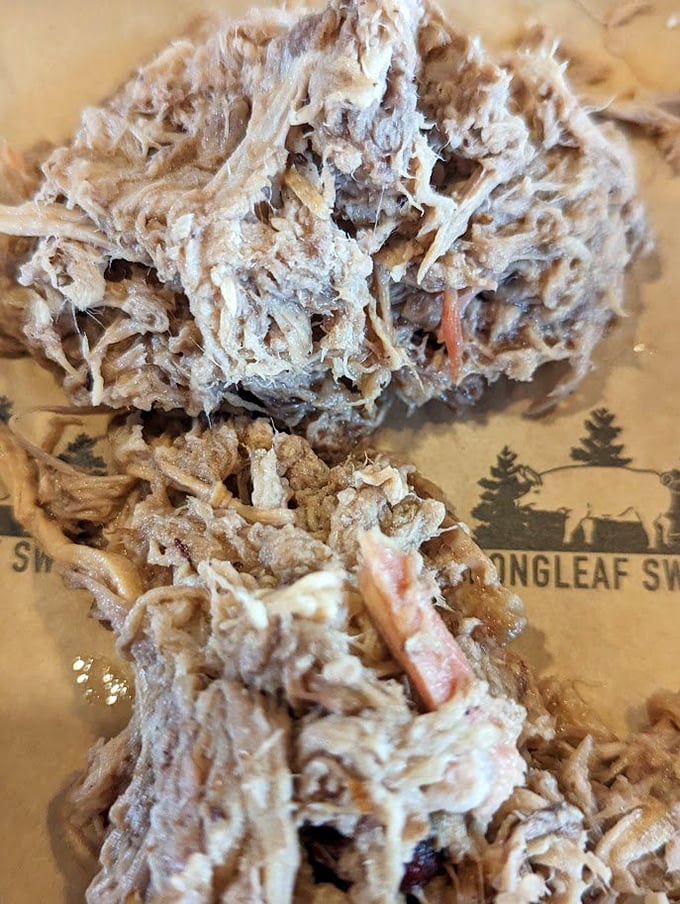 This pulled pork is barbecue in its purest form – tender strands of smoky perfection that practically melt on the tongue without drowning in sauce.