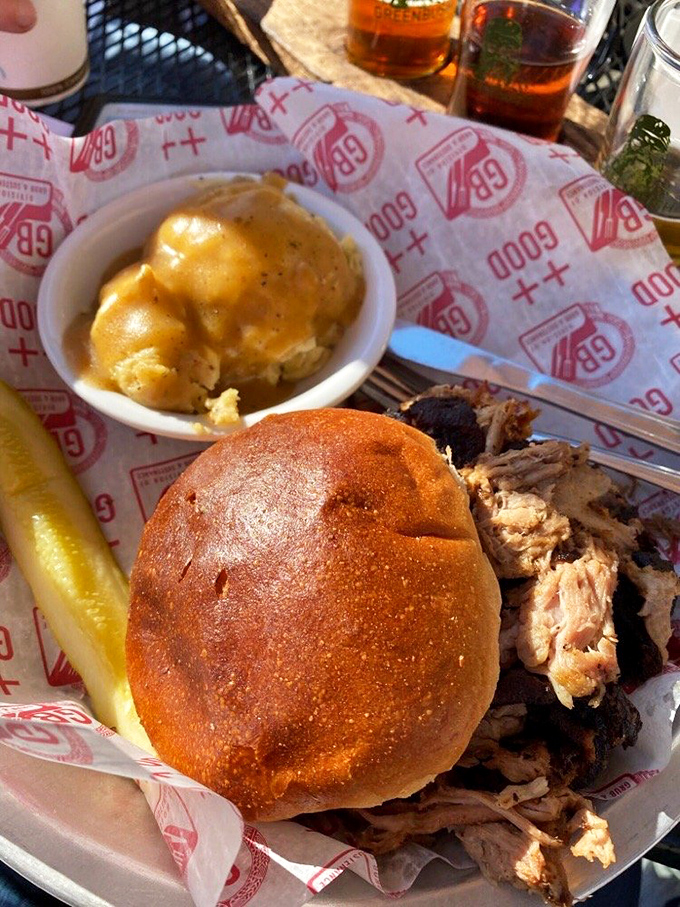 This pulled pork sandwich isn't just food; it's edible poetry. The mac and cheese side isn't playing second fiddle—it's conducting its own symphony.