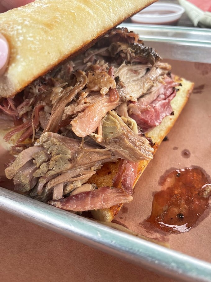 This pulled pork sandwich isn't just a meal; it's a commitment to excellence that requires both napkins and a moment of respectful silence.