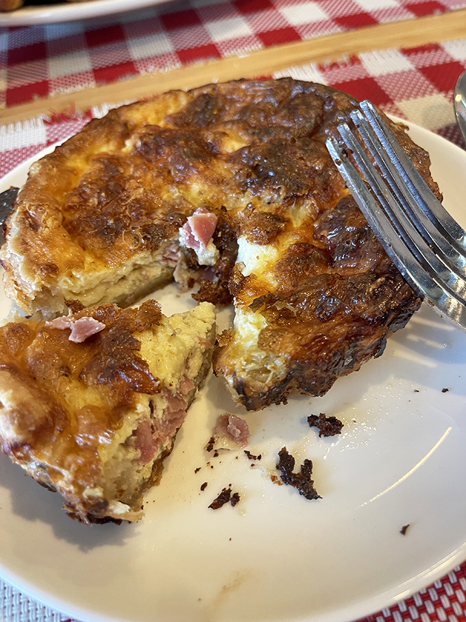 This quiche isn't just breakfast—it's a buttery revelation with chunks of ham nestled in a custard that puts all other egg dishes on notice.