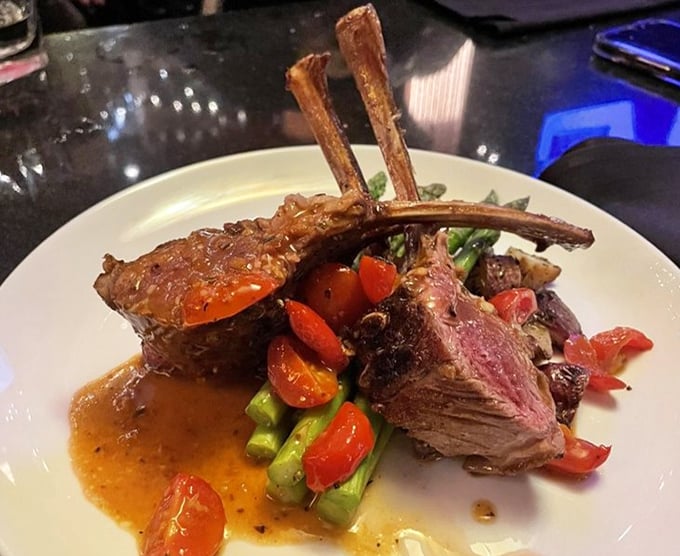 Behold the rack of lamb—perfectly pink, expertly frenched, and surrounded by colorful vegetables. This is food that makes you want to applaud.
