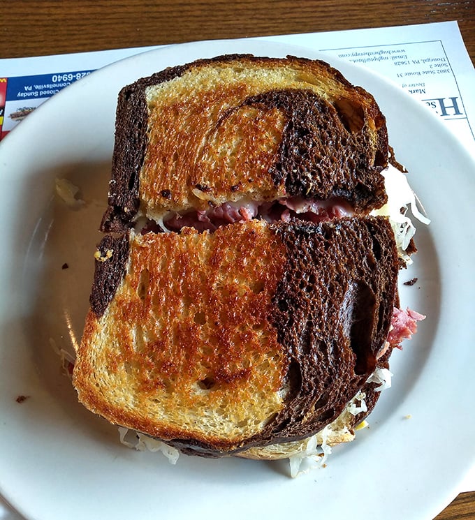 The Reuben that launched a thousand food pilgrimages—perfectly grilled rye holding a mountain of corned beef and sauerkraut.