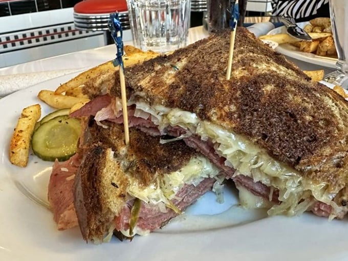 Behold the star attraction: layers of tender corned beef, tangy sauerkraut, and melted Swiss on perfectly grilled marble rye. This sandwich doesn't just satisfy—it transforms your day.