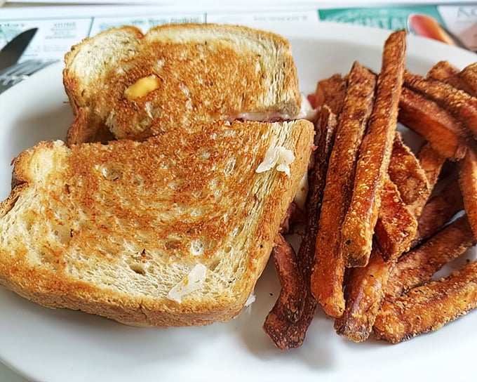 Golden-grilled perfection meets sweet potato fries. This sandwich isn't just lunch—it's therapy between two slices of perfectly toasted bread.