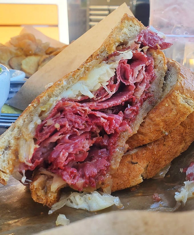 The legendary Reuben in all its glory – where corned beef, sauerkraut, and Swiss cheese achieve perfect harmony. Worth every napkin you'll need.