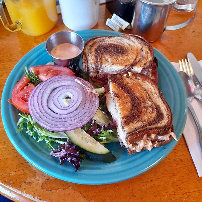 This sandwich isn't just grilled—it's been transformed into a masterpiece of melty cheese and perfectly toasted rye that demands to be photographed before devoured.