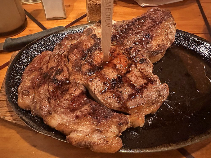 The ribeye arrives like a celebrity making an entrance – sizzling, commanding attention, and worth every bit of the anticipation.