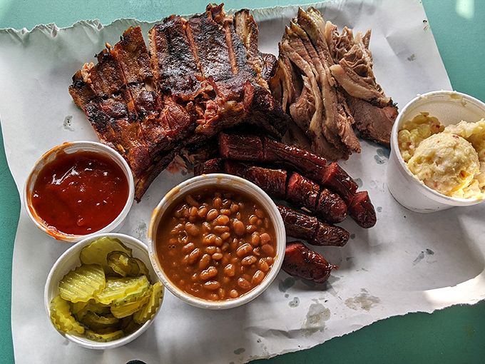 Barbecue nirvana on butcher paper. Those ribs with their mahogany bark, that brisket with its perfect smoke ring, and sides that know their supporting role.