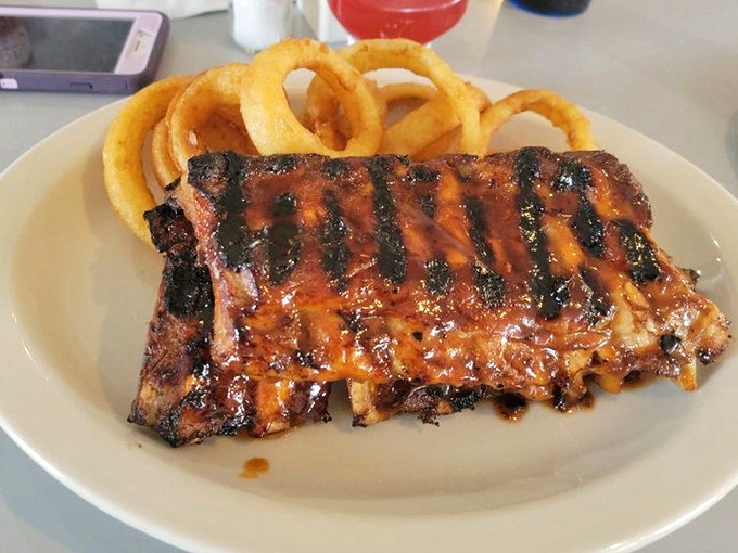 These ribs don't just fall off the bone—they practically leap into your mouth with perfect grill marks and a glaze that glistens like edible jewelry.