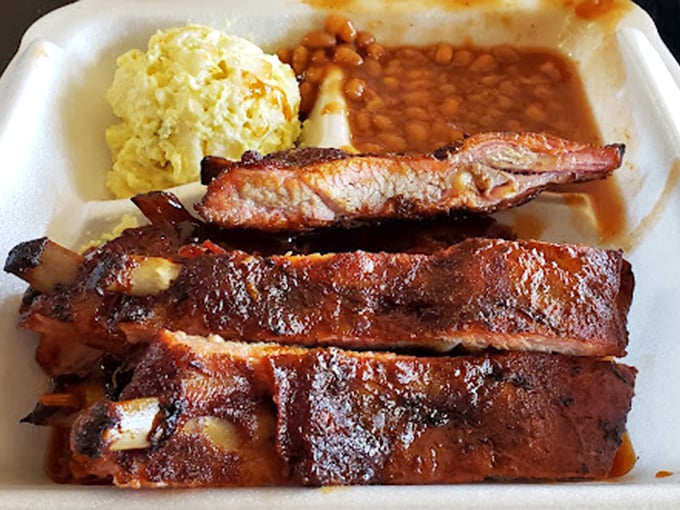 These ribs aren't just cooked—they're transformed. That smoke ring is the barbecue equivalent of a Picasso signature, announcing true mastery of the craft.