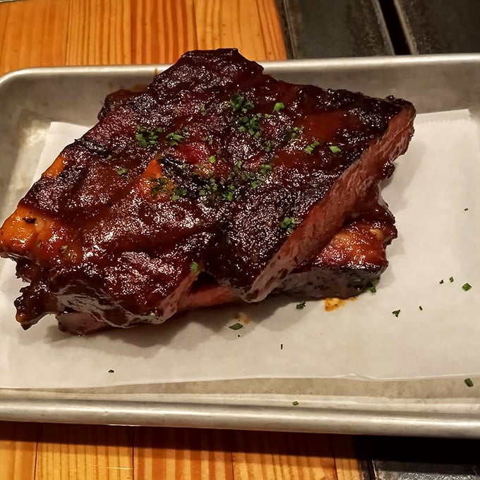 These ribs don't just fall off the bone—they practically leap into your mouth with a perfect bark that would make tree surgeons jealous.