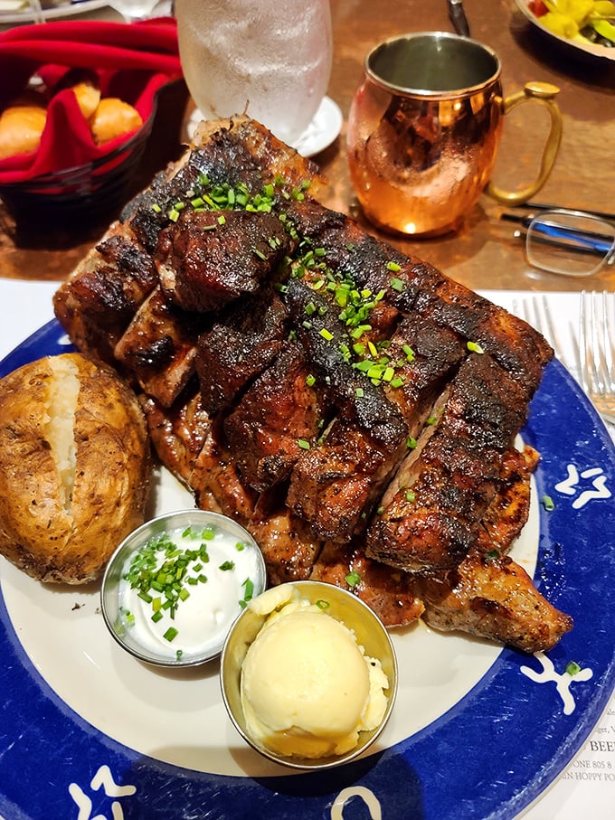 These ribs don't just fall off the bone—they practically leap onto your fork in surrender. Served with a baked potato that's dressed better than I am.