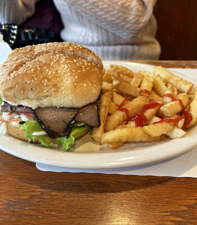 This roast beef sandwich isn't just lunch—it's architecture. Perfectly stacked layers of beef, fresh veggies, and those golden fries deserve their own blueprint.