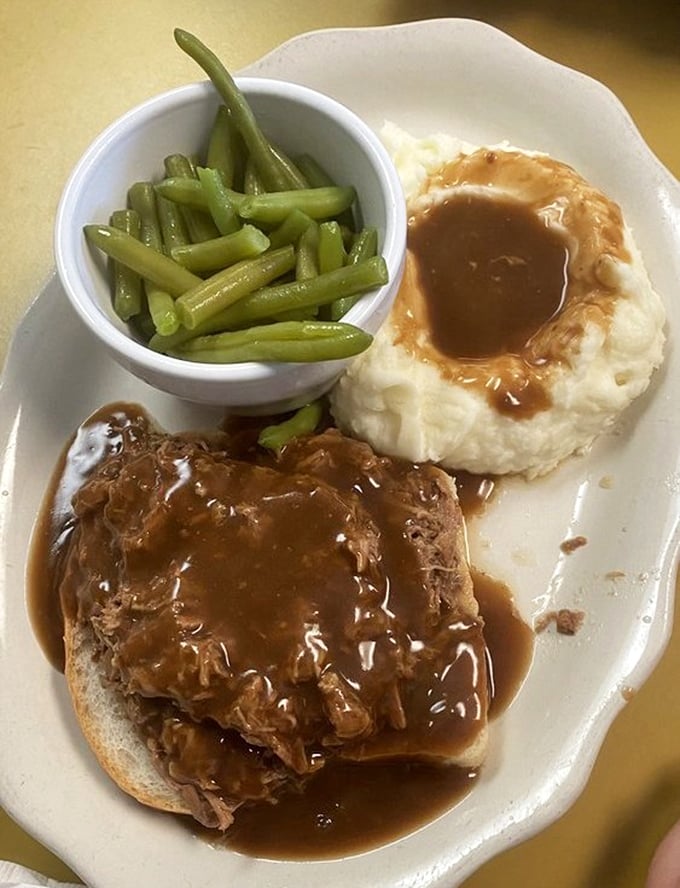 This isn't just roast beef – it's a tender masterpiece swimming in gravy that would make your grandmother weep with pride. The mashed potatoes create the perfect gravy lake.