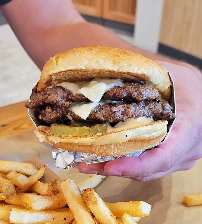 Behold the perfect smash burger—crispy-edged patties, melty cheese, and a bun that knows its supporting role without stealing the show.