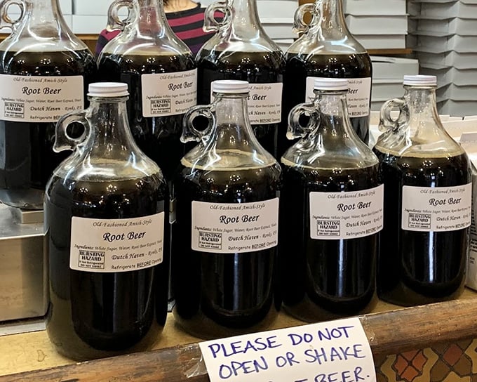 Bottles of liquid gold lined up like Pennsylvania's answer to fine wine – homemade root beer perfection awaits.