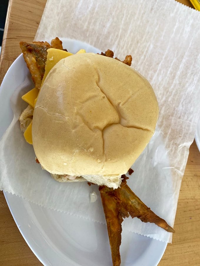 Behold the famous Pan con Minuta – that fish tail sticking out isn't just showing off, it's proof you're getting the real deal. The seafood equivalent of a designer label.