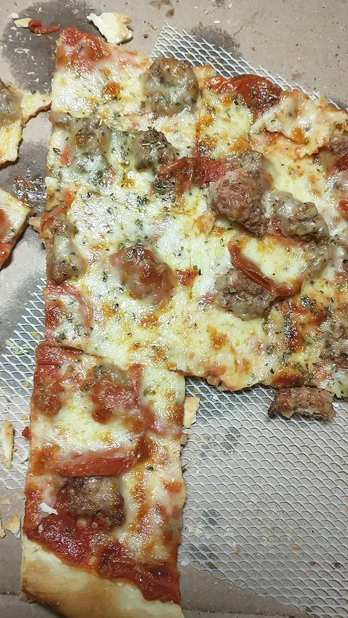 Pizza perfection doesn't happen by accident. This sausage-studded masterpiece proves that sometimes more is exactly enough.