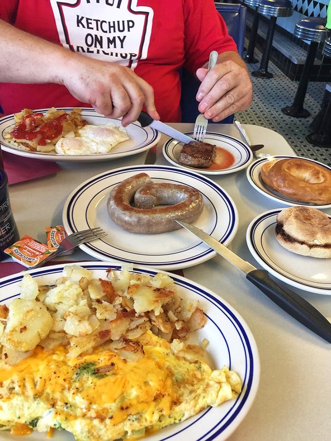 Behold the star attraction—a perfectly cooked sausage link with that ideal snap, surrounded by a breakfast spread worthy of royalty.