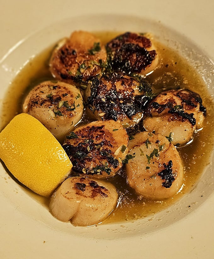 These seared scallops aren't just cooked—they're transformed into buttery ocean treasures swimming in a sauce you'll want to bottle and take home.