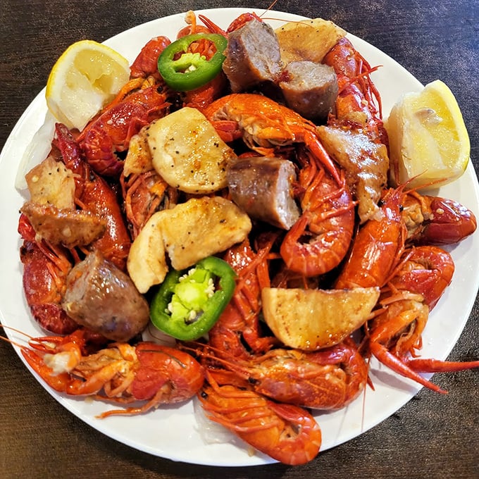 A plate that would make Neptune jealous—crawfish, sausage, and potatoes mingling like old friends at a spicy underwater party.