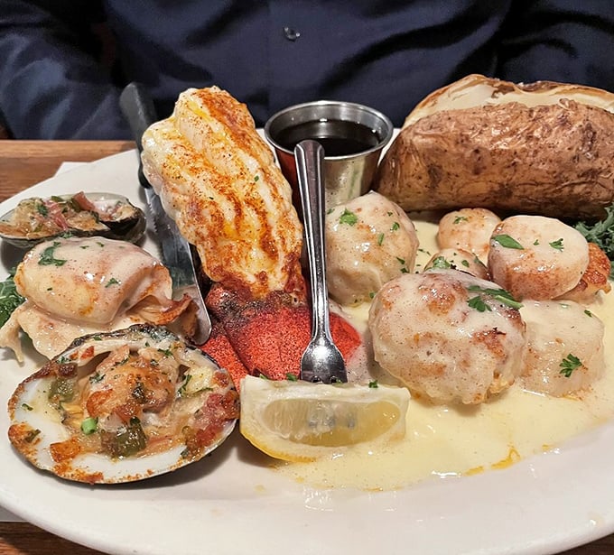 A seafood platter that would make Neptune himself jealous—perfectly seared scallops, stuffed clams, and lobster tail arranged with the precision of edible art.