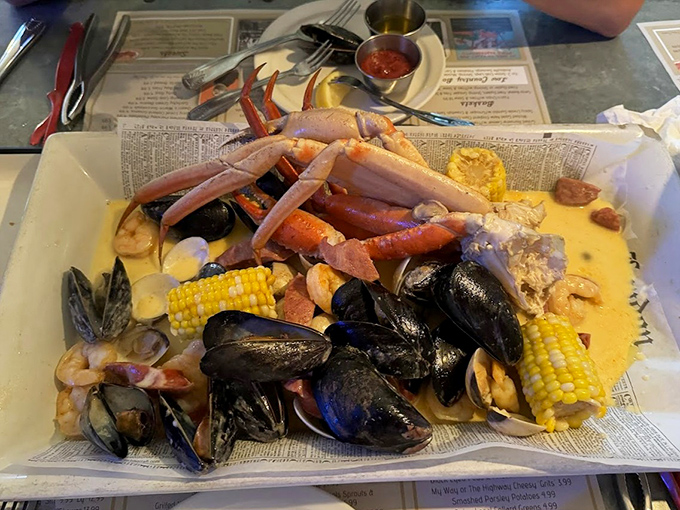 The Low Country Boil arrives like Neptune's personal feast – crab legs reaching skyward as if saying "pick me first!" A glorious mess worth every napkin.