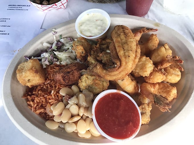 This isn't just a seafood platter – it's a Lowcountry love letter featuring golden fried treasures, red rice, and lima beans that would make any grandma proud.