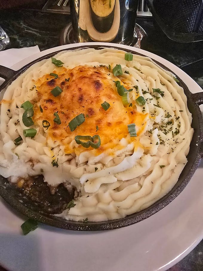Behold the crown jewel – a shepherd's pie that would make an Irish grandmother weep with joy, crowned with perfectly browned potato peaks.