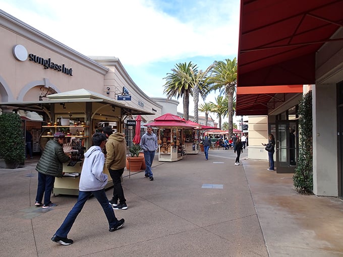 Serious shoppers on a mission. Notice how everyone walks with purpose—that's the stride of people who've spotted 70% off signs from 50 yards away.