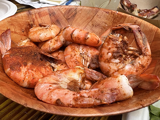 These aren't just shrimp—they're a masterclass in simplicity. Perfectly seasoned, expertly cooked, and served in a wooden bowl that would make Neptune himself jealous.