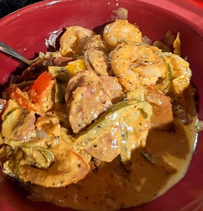 Their Shrimp and Grits elevates a Southern classic with plump shrimp and savory sauce – comfort food that hugs you from the inside out.