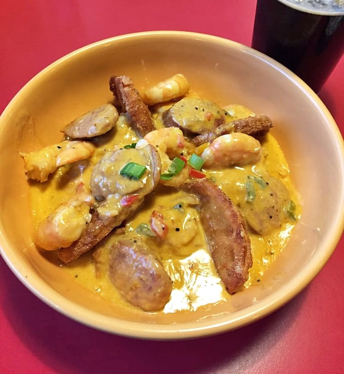 Shrimp and grits that would make a Charleston chef weep with joy – plump shrimp, smoky bacon, and creamy grits creating a holy trinity of Southern flavor.