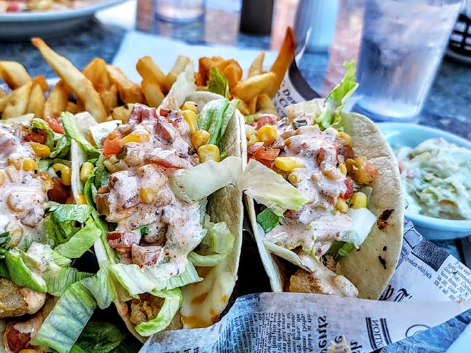 These aren't just shrimp tacos—they're edible love letters from the sea, stuffed with plump shrimp, fresh veggies, and that magical sauce.