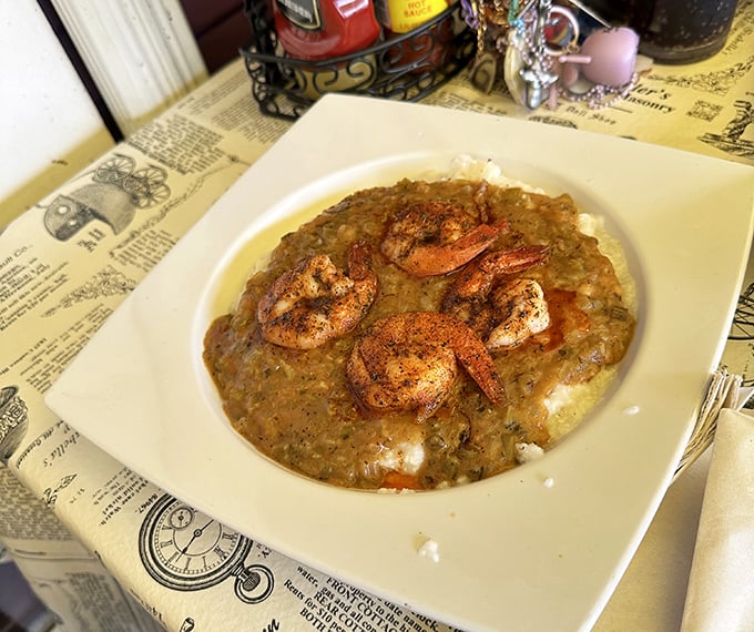 Shrimp and grits that would make a Southerner weep with joy—plump crustaceans nestled on a creamy bed of comfort that whispers, "Take your time, sugar."