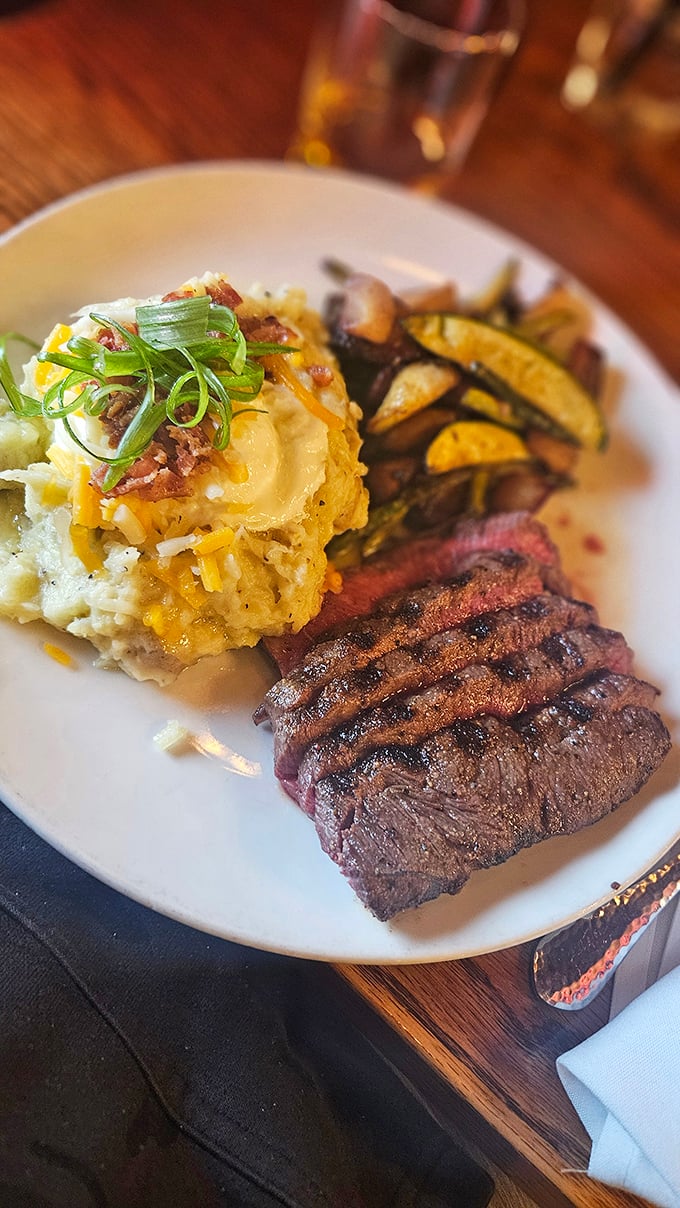This isn't just a steak – it's a masterpiece of meat, accompanied by a loaded potato that's practically begging to be your side hustle.