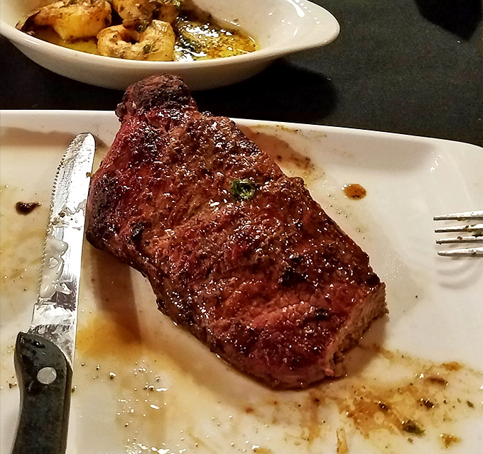 Behold the sirloin in its natural habitat—perfectly seared, glistening with juices, and practically begging for your steak knife's attention.