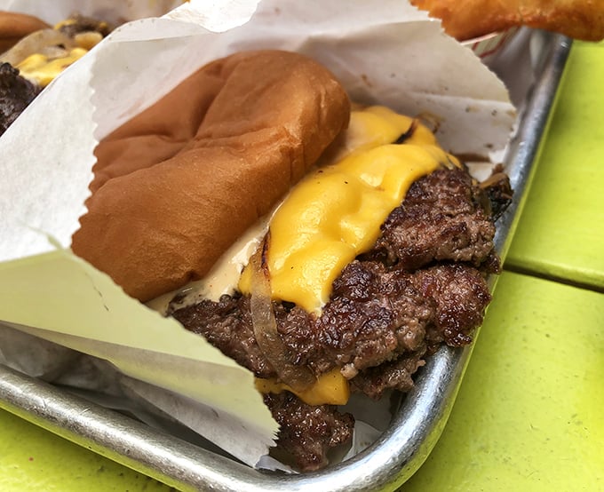 Behold the PS Burger in all its glory—those crispy-edged patties with melty cheese are what food dreams are made of.