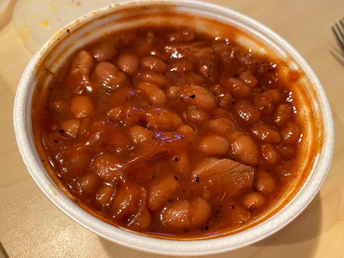 These smoked baked beans aren't just a side dish—they're the unsung heroes of the barbecue world, swimming in a sauce that deserves its own fan club.