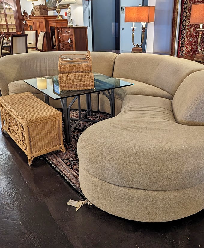 This curved sofa isn't just seating—it's a statement that says, "Yes, I have both style and enough space for furniture that doesn't fit against walls."