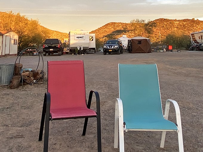 Sunset at Sonoran Skies Campground offers the perfect desert tableau—colorful chairs inviting you to sit and contemplate life's big questions, like "How early is too early for wine?"