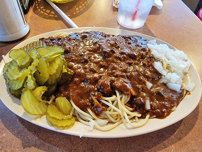 Behold the star attraction—spaghetti that defies diner expectations, with meat sauce so rich and hearty it could make an Italian grandmother question her recipe.