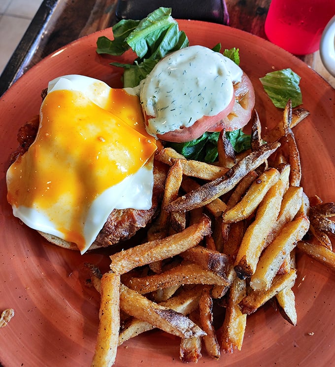 Eggs Benedict with a golden cascade of hollandaise and perfectly crisp home fries—proof that sometimes the classics need no improvement. 